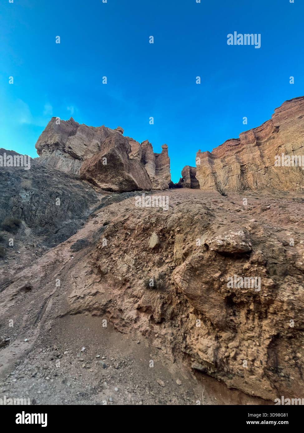 Rock towers in the desert: rugged texture, layered cliffs and clear ...