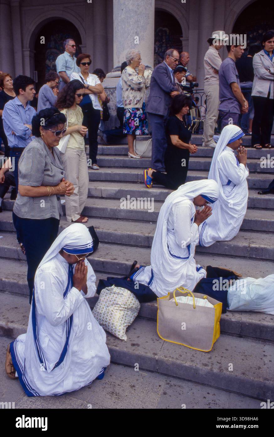Portugal, nuns pray before Basilica of Our Lady of the Rosary of Fatima ...