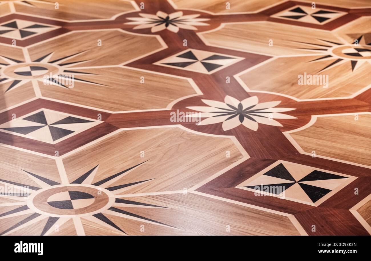 Wooden parquet with different wood types create intricate geometric ...