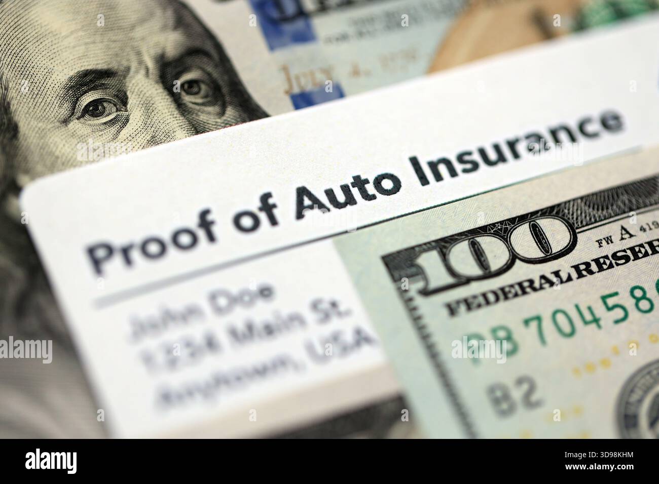 Proof of auto insurance card and many hundred dollar bills. Concept of ...
