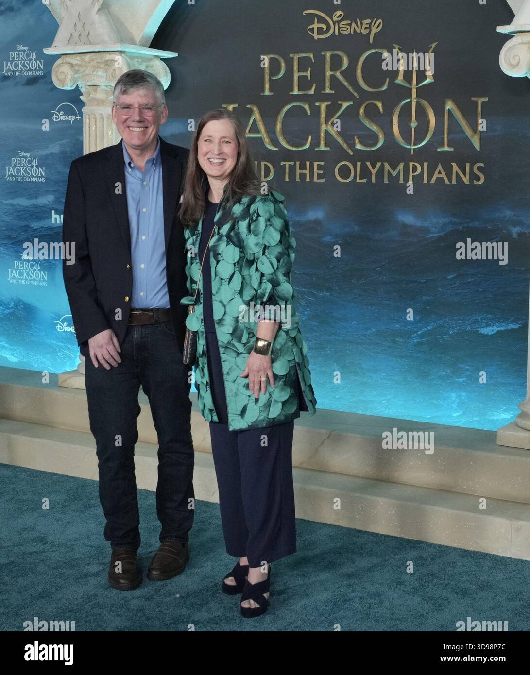 (L-R) Rick Riordan and wife Becky Riordan at the Disney+ Original ...