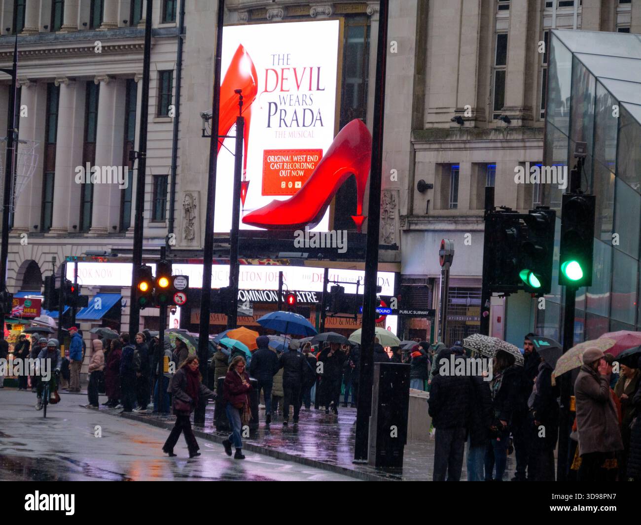 Pedestrians walk past the Dominion Theatre in London’s West End, with ...