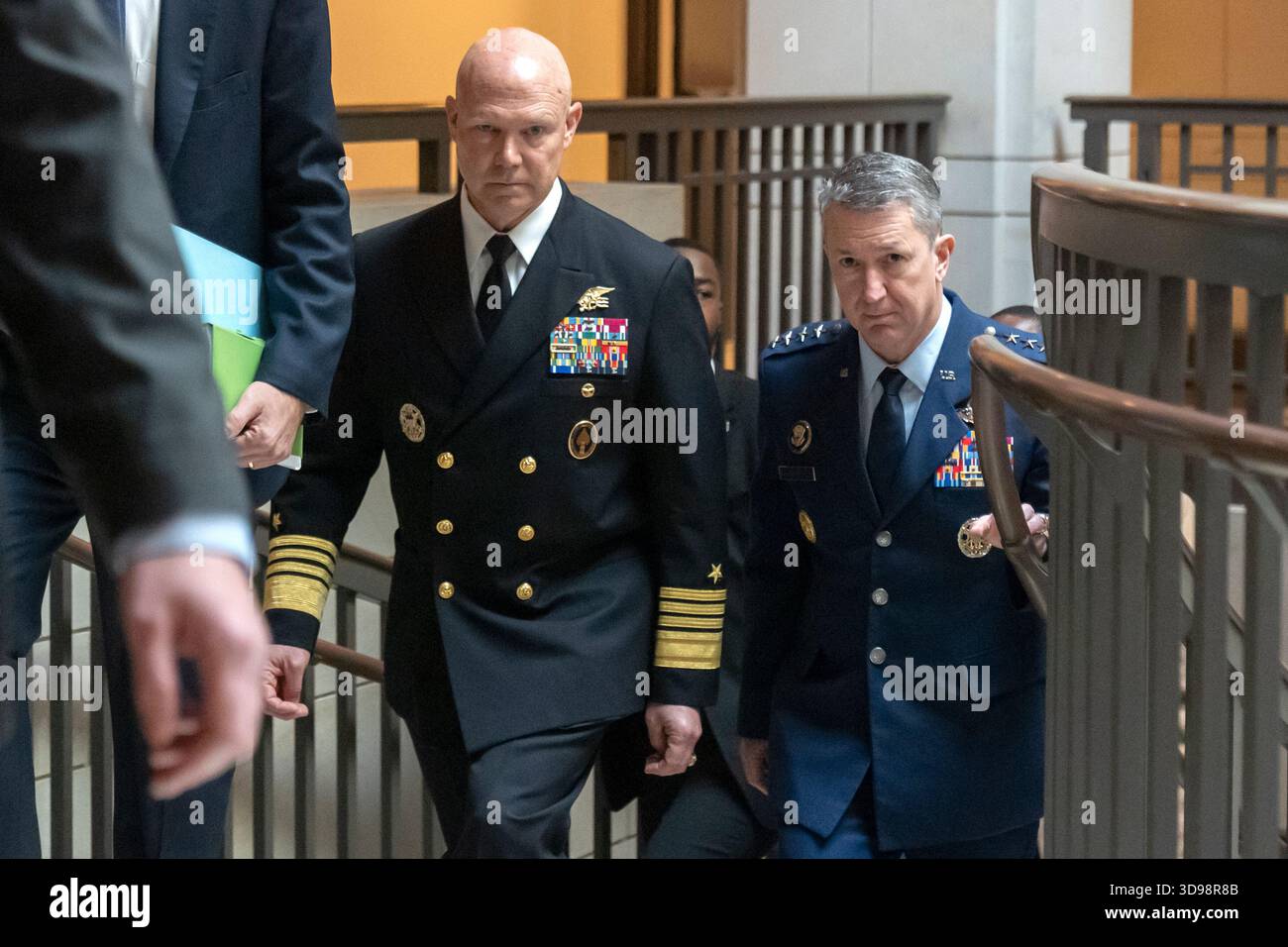 U.S. Navy Adm. Frank M. Bradley, accompanied by Gen. Dan Caine ...
