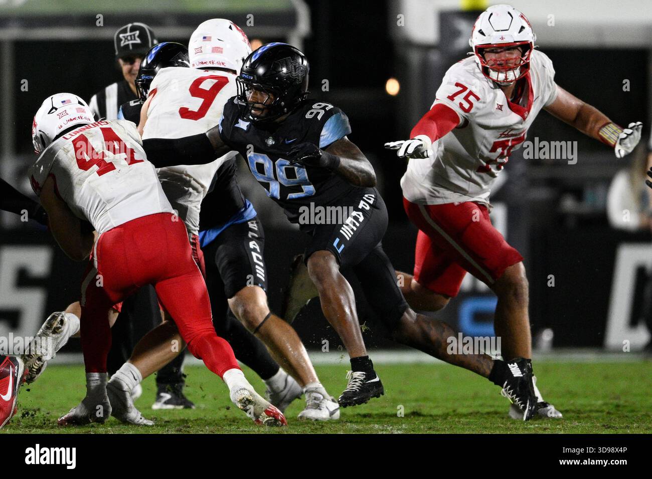 Central Florida defensive end Jamaal Johnson (99) tackles Houston ...