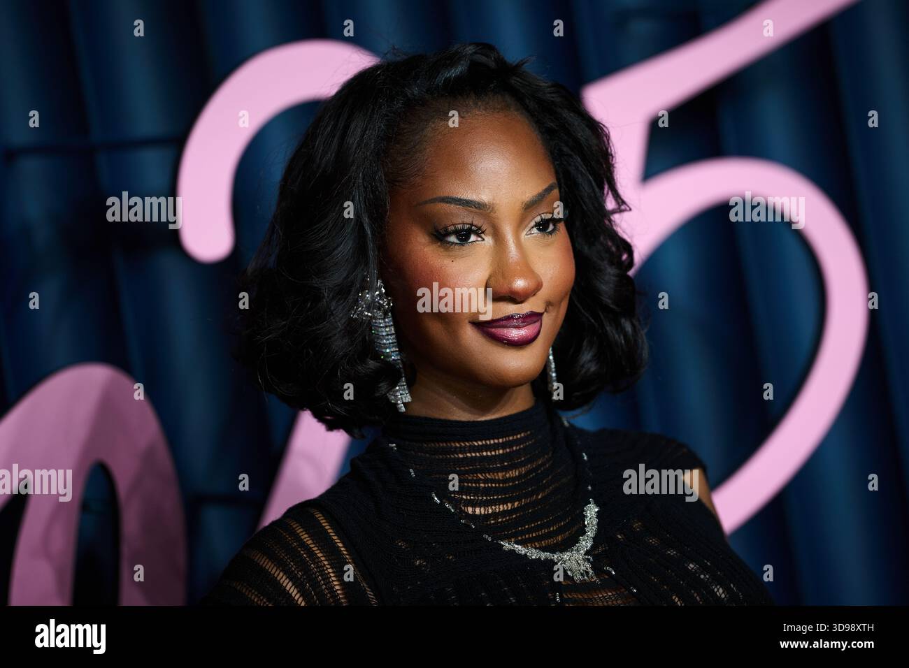 Tems poses for photographers upon arrival at 'The Fashion Awards 2025 ...