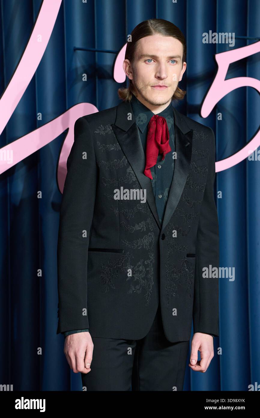 Ewan Mitchell poses for photographers upon arrival at 'The Fashion ...