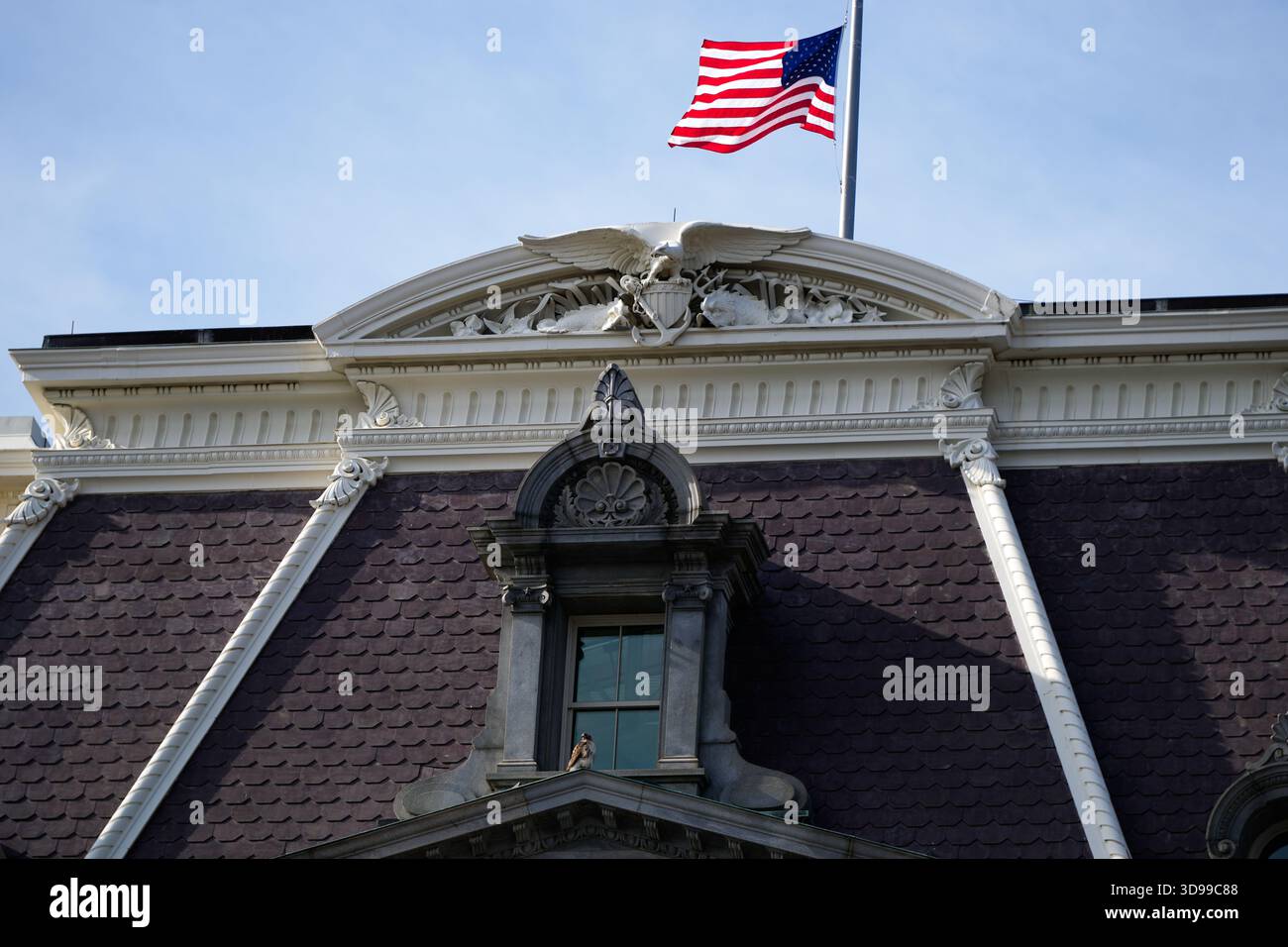The American flag on the Eisenhower Executive Office Building flies ...