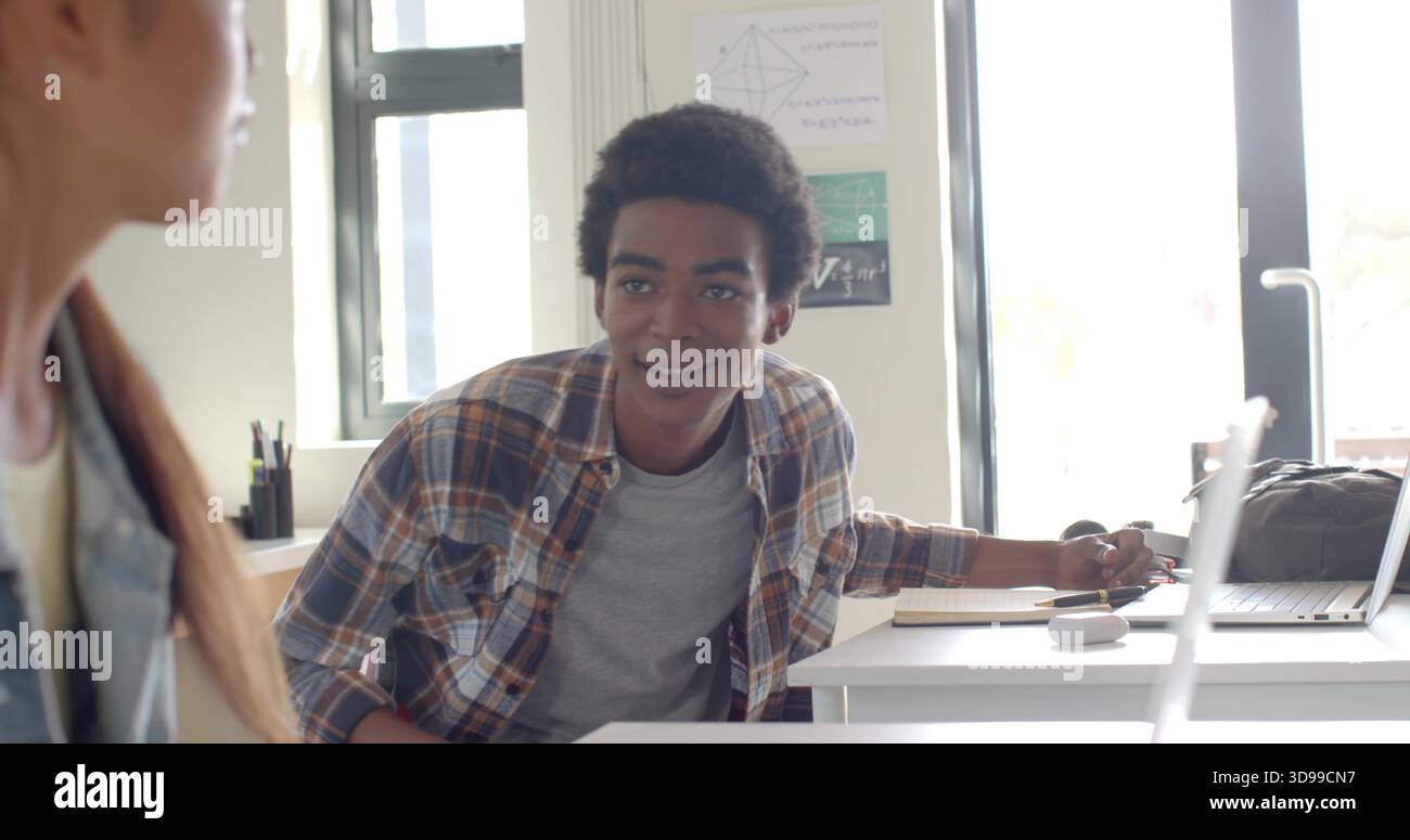 Student smiling reaching in classroom hi-res stock photography and ...