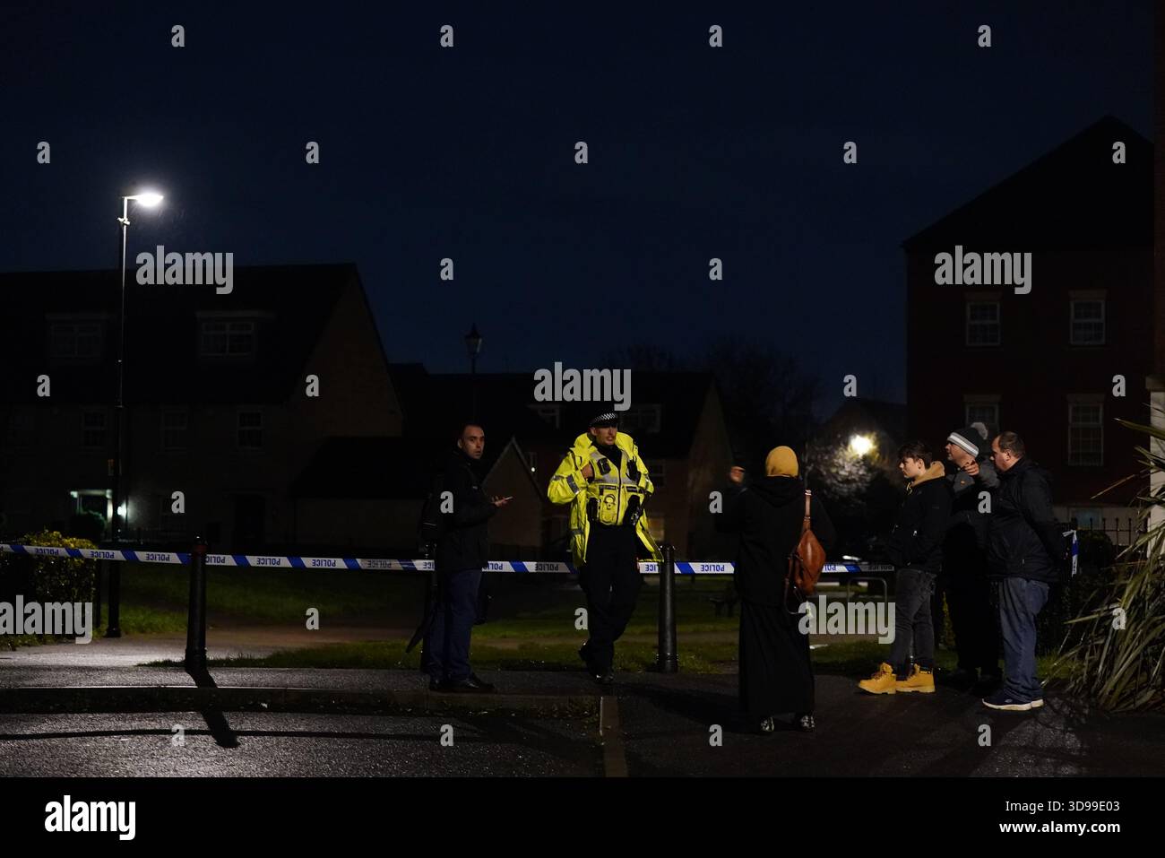 Police officers on Reeves Road in Derby, following a controlled ...