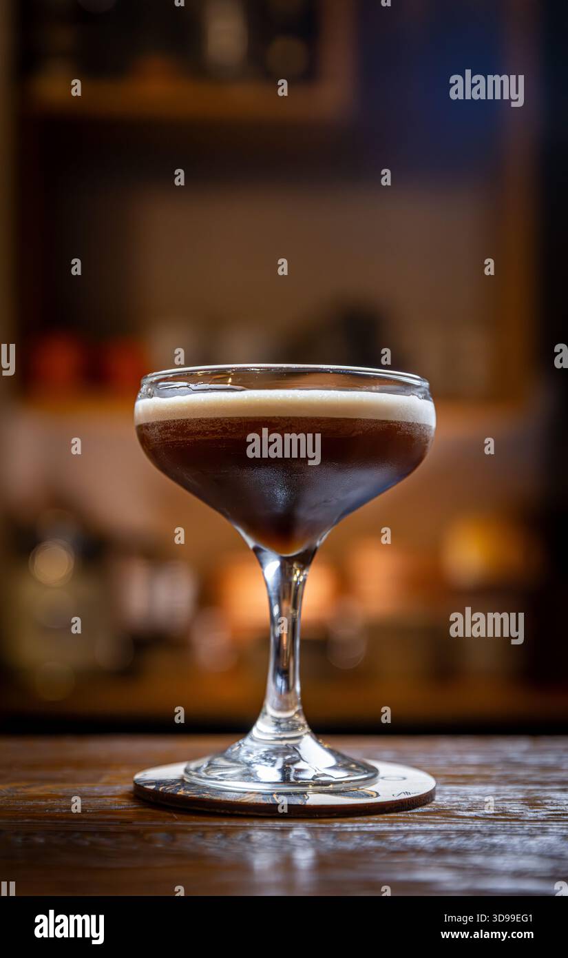 Espresso martini cocktail with foam on a bar counter Stock Photo - Alamy
