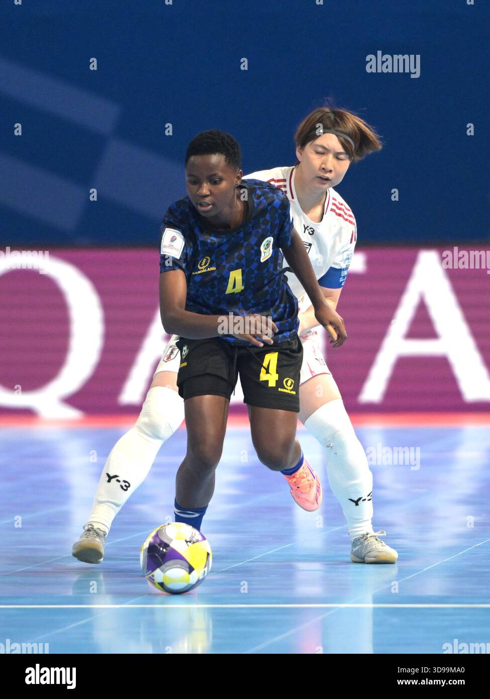 Winfrida Charles Mathias (front) of Tanzania Women Futsal team and Kaho ...