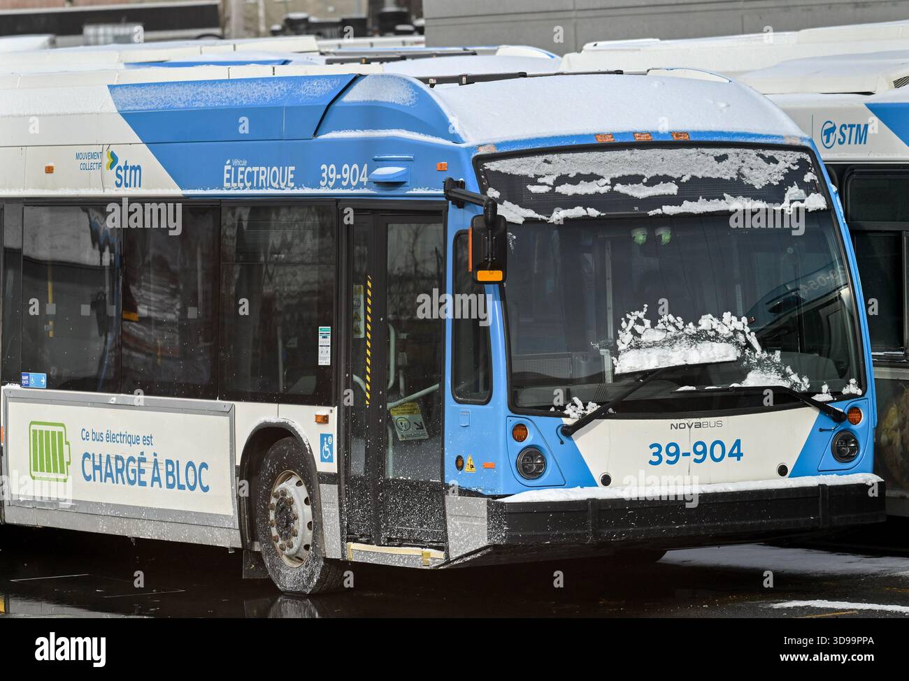 A Societe de transport de Montreal (STM) electric bus is shown parked at a garage in Montreal ...