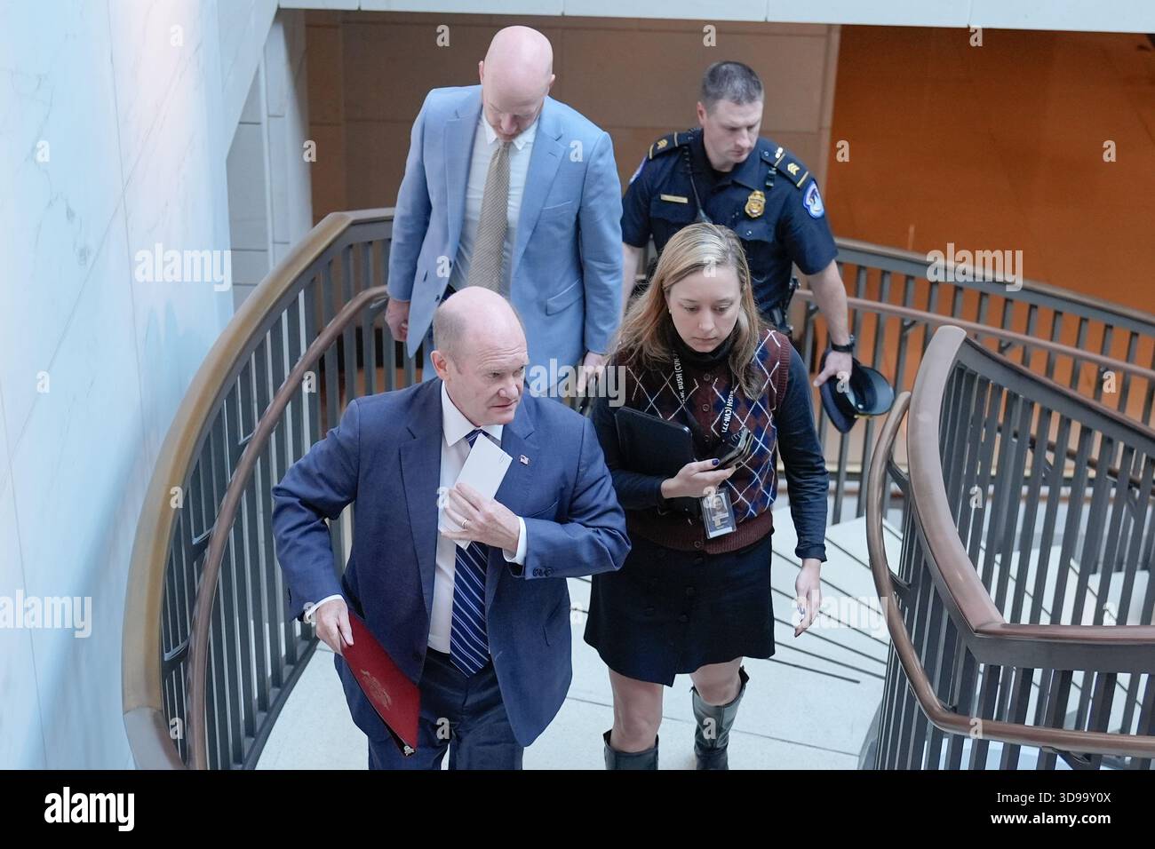 Sen. Chris Coons, D-Del., left, is seen during a meeting on Capitol ...