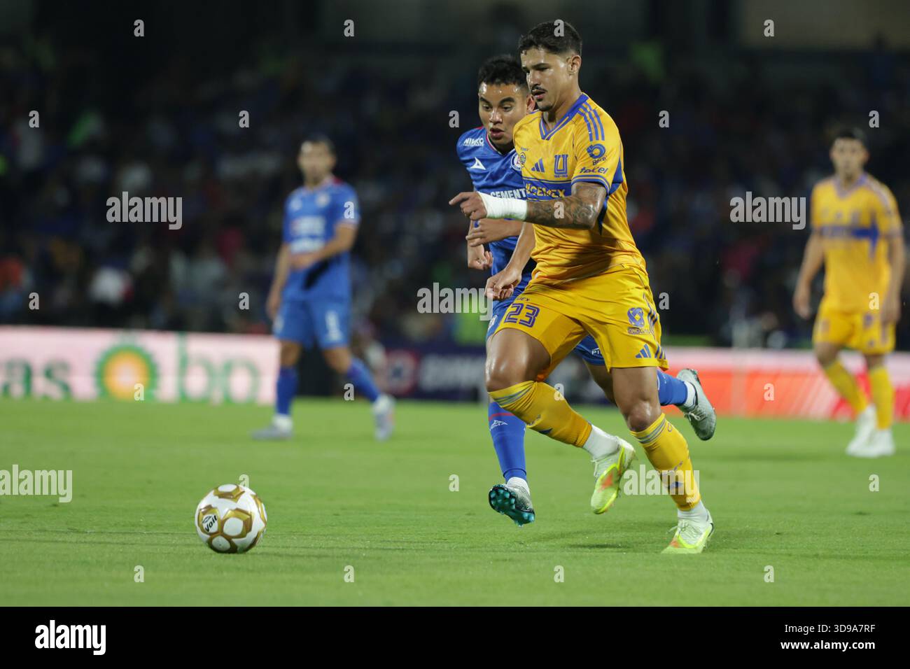 Rômulo Zwarg #23 of Club Tigres and Carlos Rodriguez #19 of Cruz Azul ...