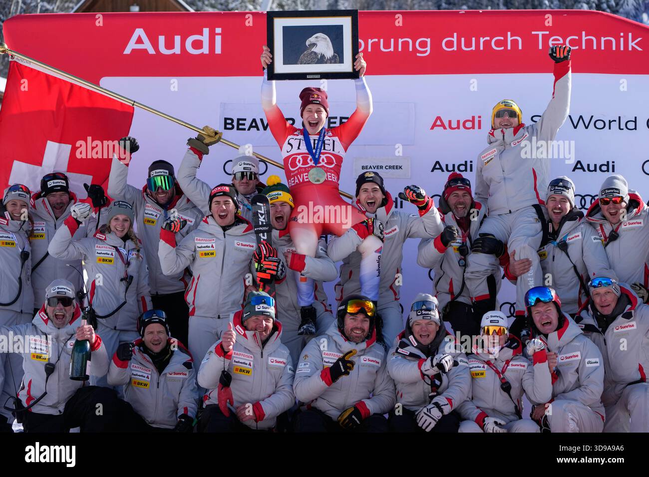 First place finisher Switzerland's Marco Odermatt celebrates with team ...