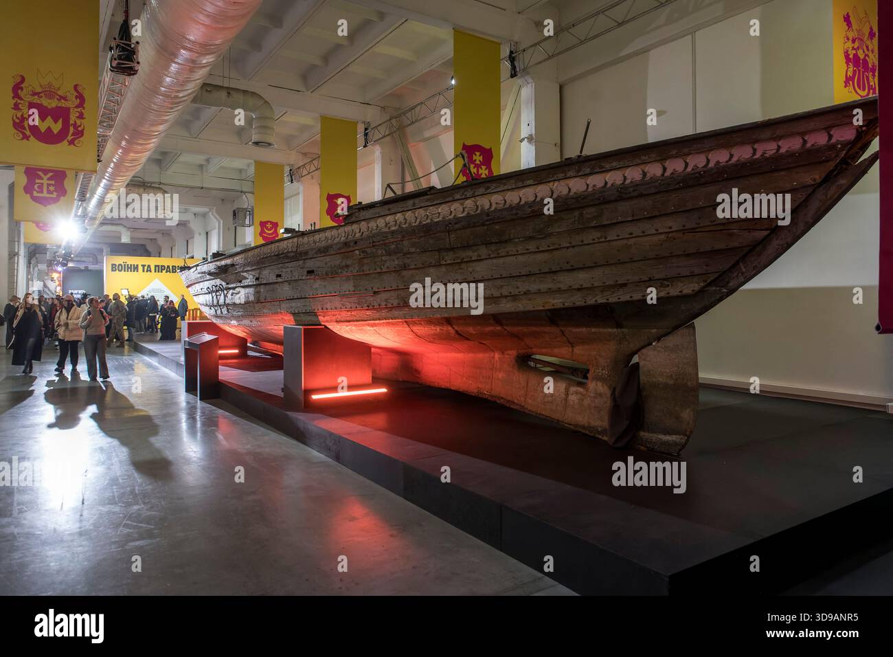 Kyiv, Ukraine. 03rd Dec, 2025. Visitors look at a replica of a Cossack ...