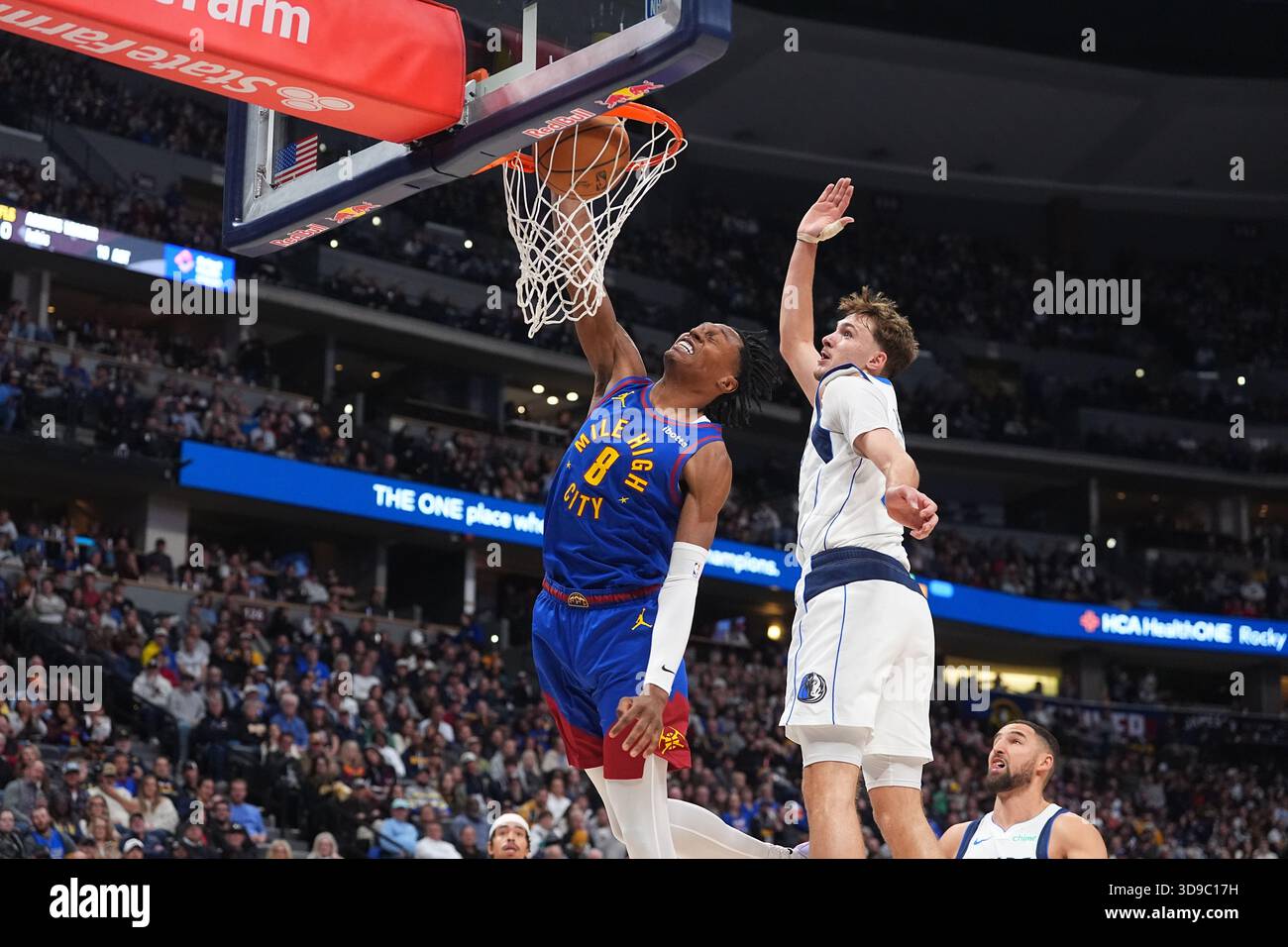 Denver Nuggets guard Peyton Watson (8) and Dallas Mavericks forward ...