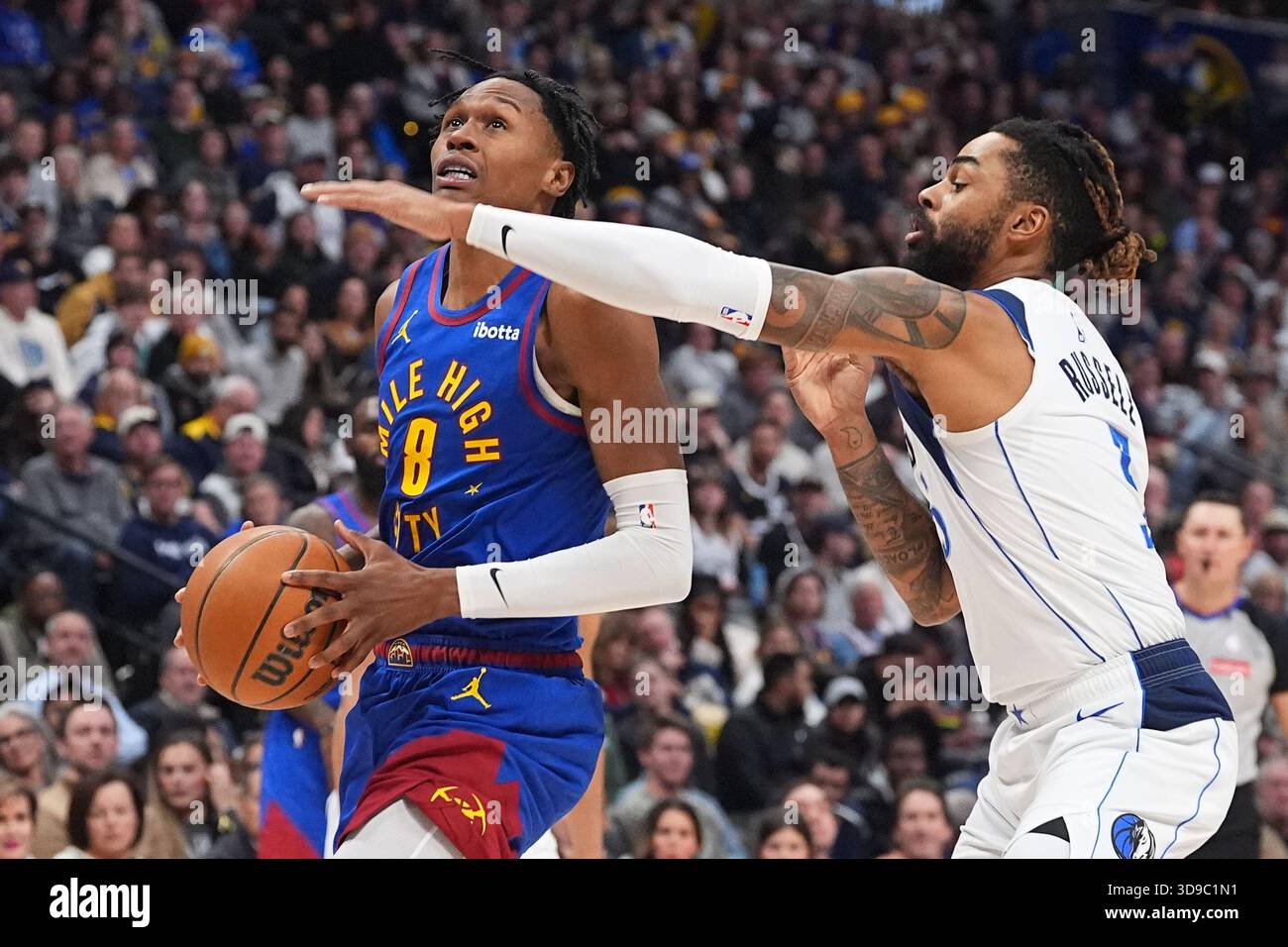 Denver Nuggets guard Peyton Watson (8) and Dallas Mavericks guard D ...