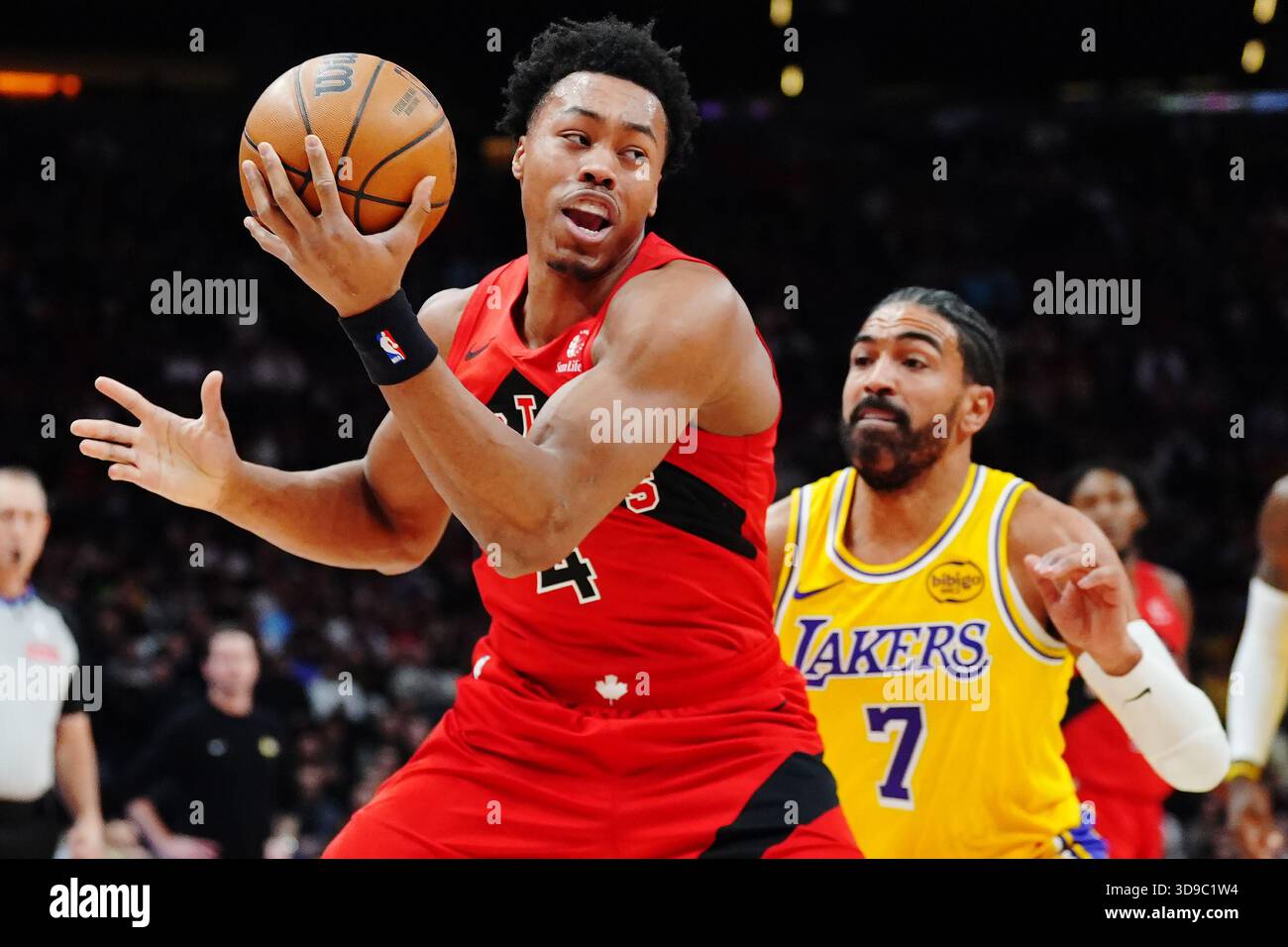 Toronto Raptors' Scottie Barnes (4) protects the ball from Los Angeles ...
