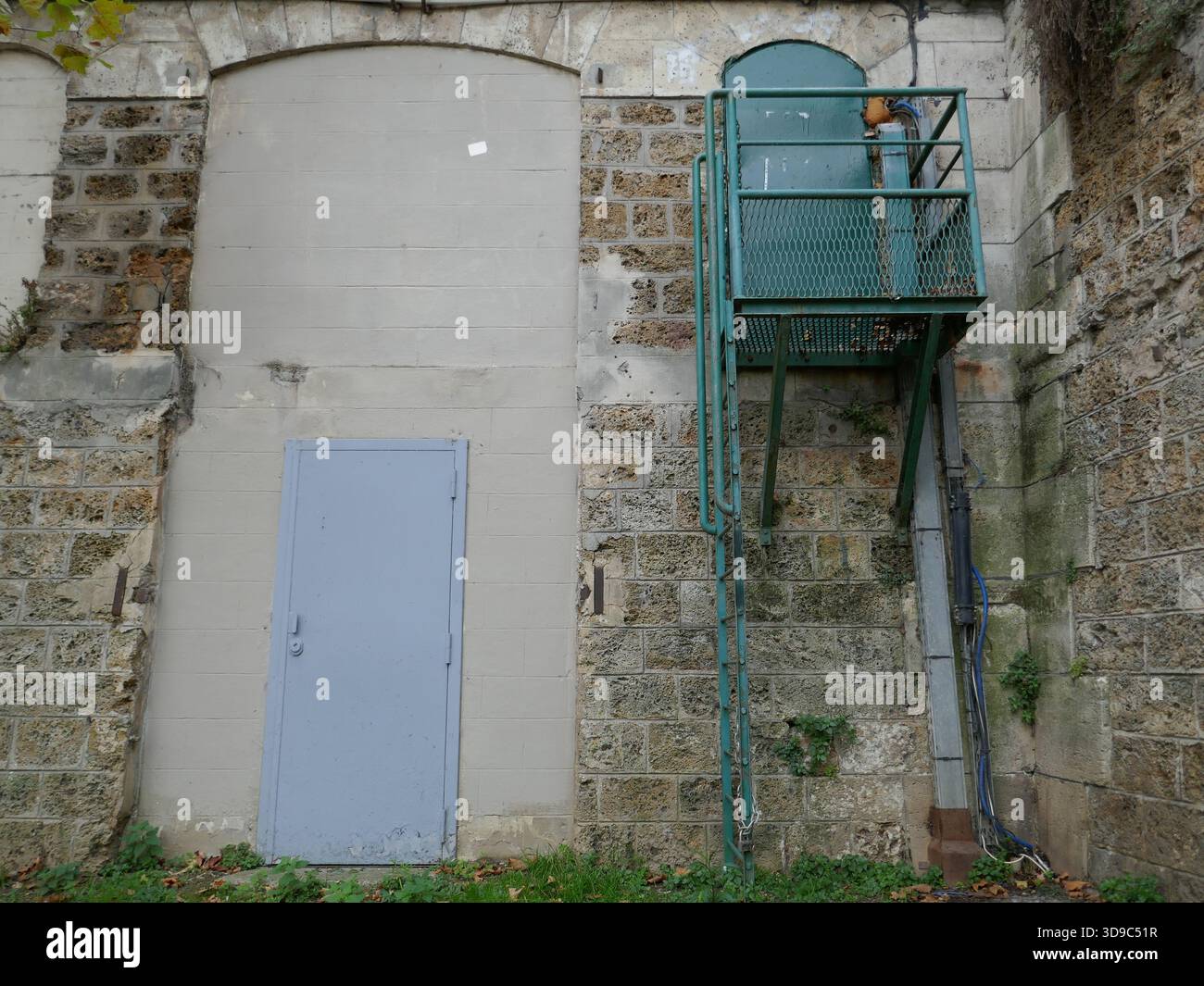 Rear of industrial building with utilitarian features, fire escape ...