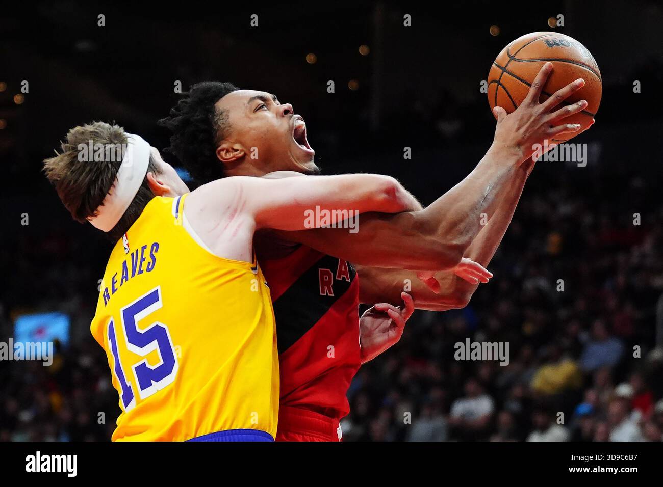 Los Angeles Lakers' Austin Reaves (15) fouls Toronto Raptors' Scottie ...