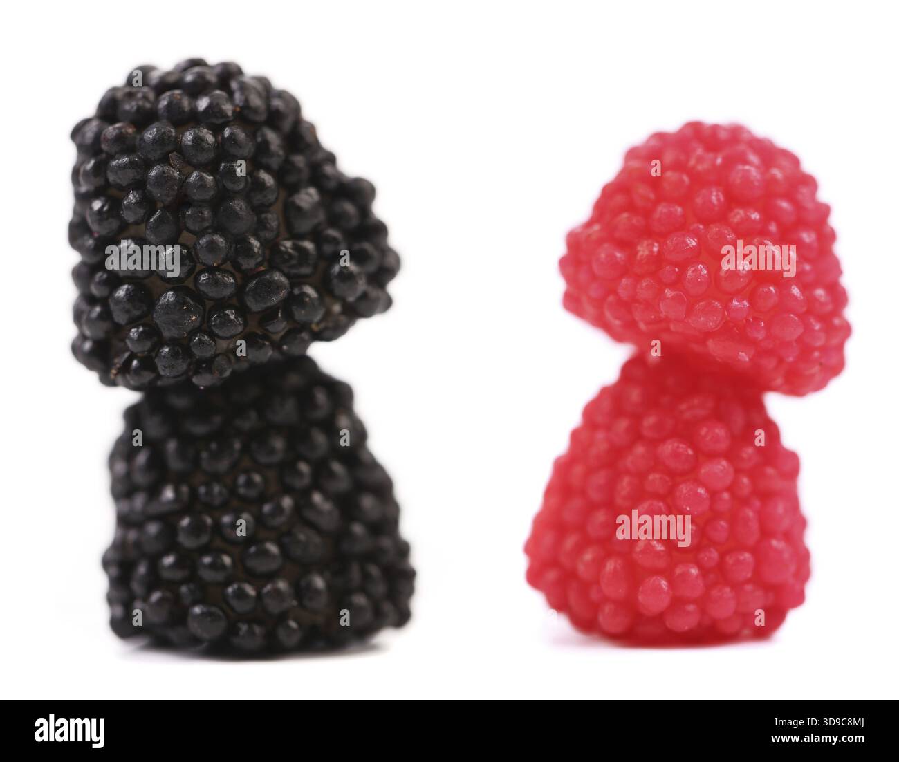 Two stacks of jelly fruit in berries candy form. Isolated on a white ...