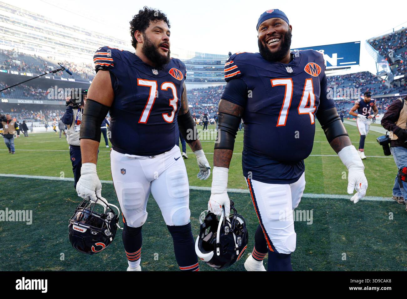 Chicago Bears guards Jonah Jackson (73) and Jordan McFadden (74) walk ...