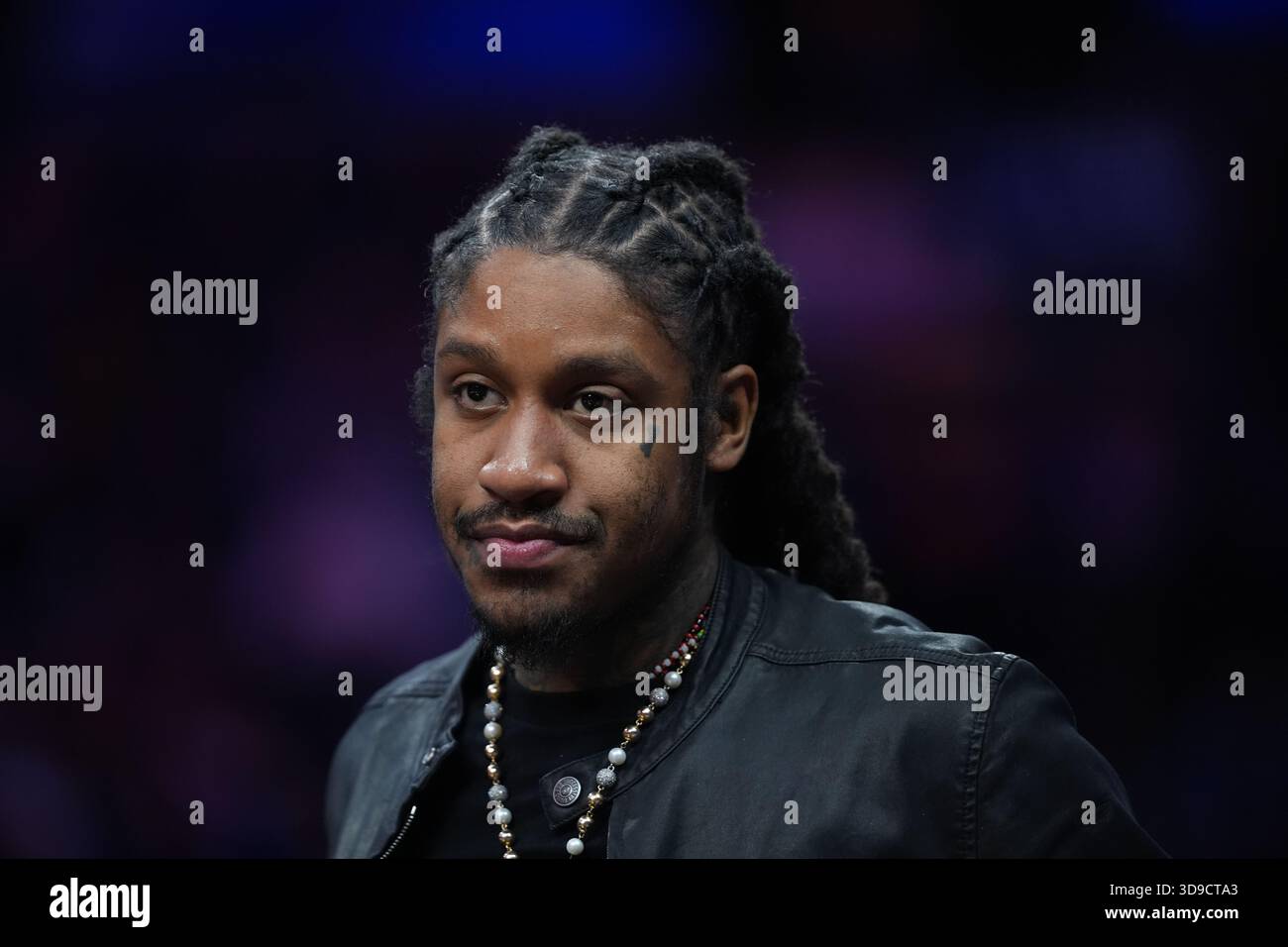 Rapper Skrilla reacts during an NBA basketball game Thursday, Dec. 4 ...