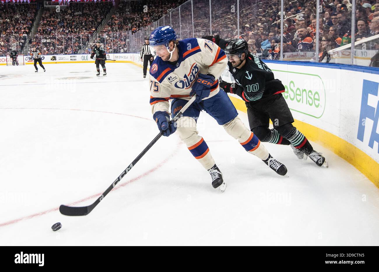 Seattle Kraken's Matty Beniers (10) chases Edmonton Oilers' Alec Regula ...