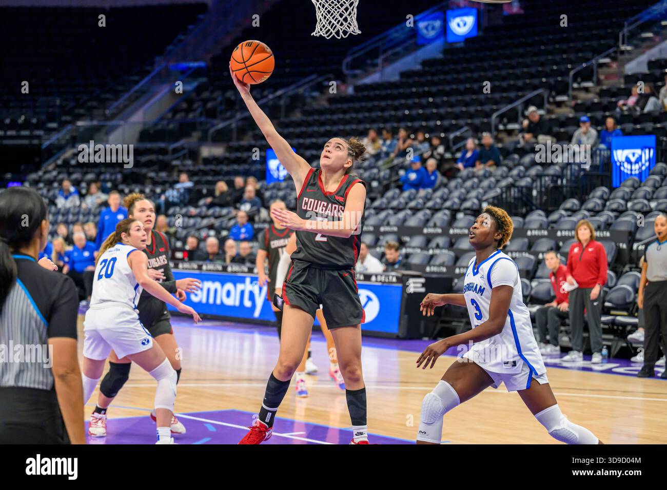 Washington State guard Eleonora Villa, center, looks to lay the ball ...