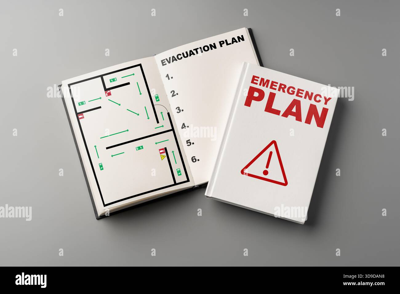 Emergency plan book with evacuation map and safety guidelines on a gray ...