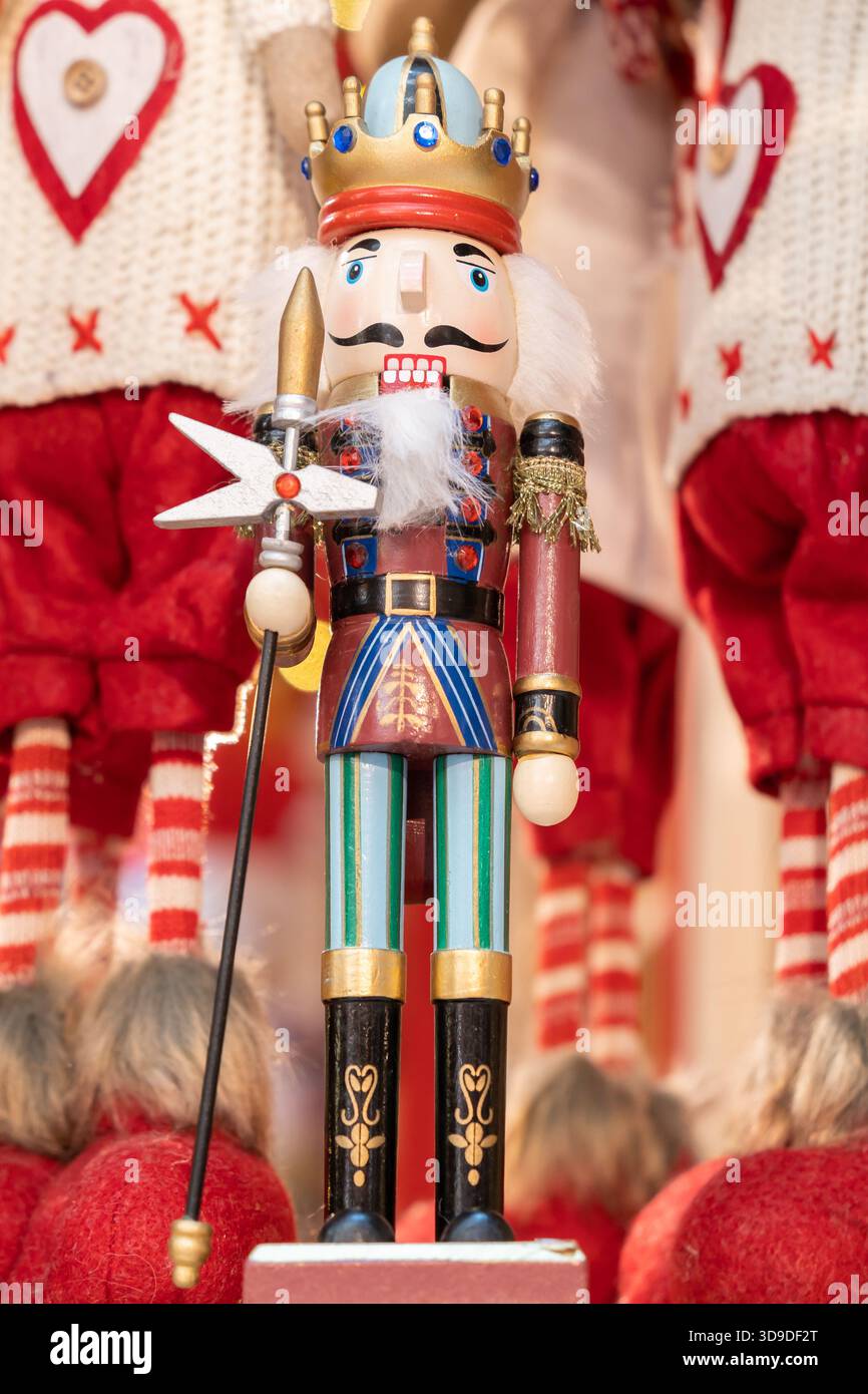 A traditional Nutcracker figure dressed as a royal soldier stands with ...