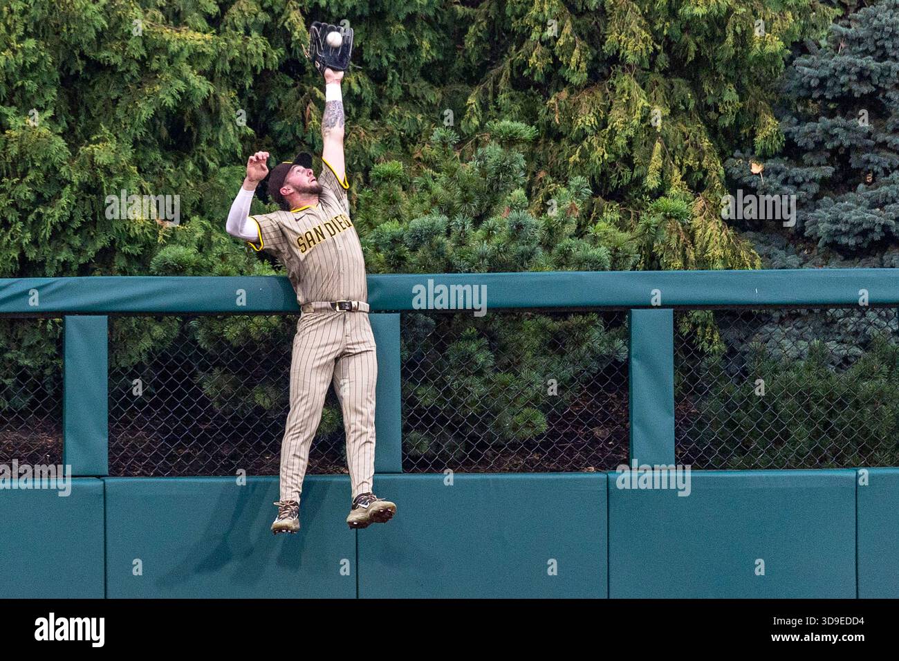 San Diego Padres center fielder Jackson Merrill leaps at the wall for a ...