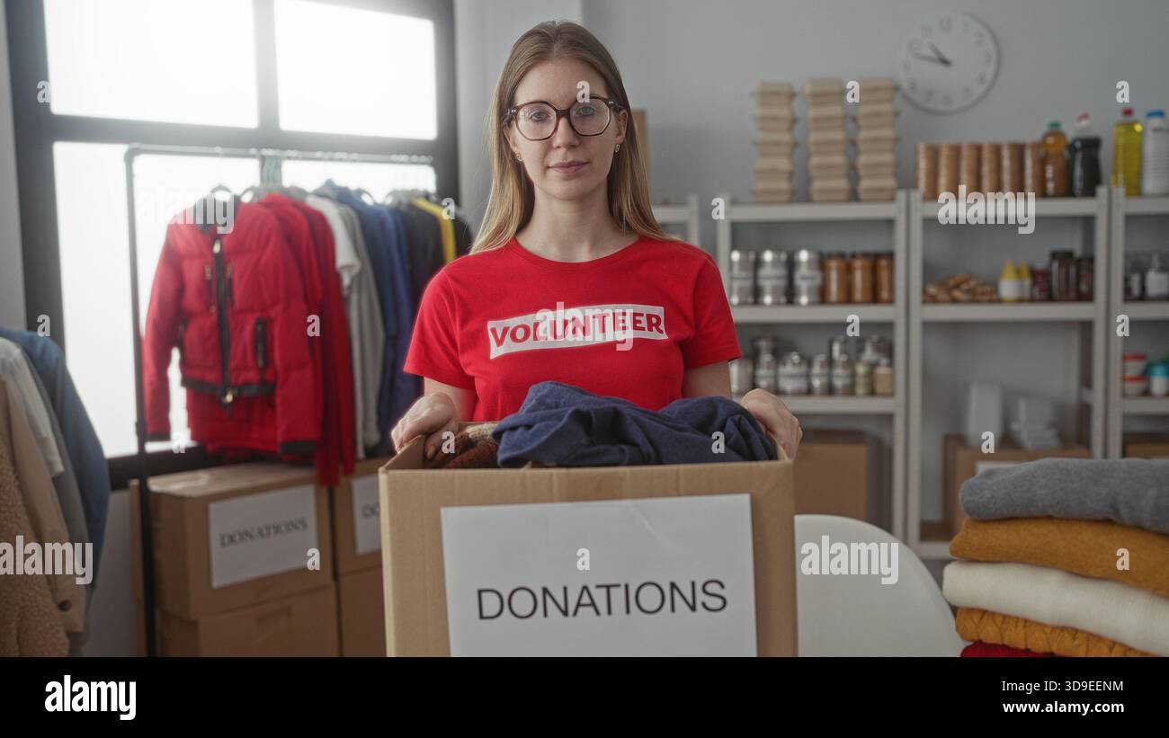 Woman forms heart shape gesture with hands over donation box in ...