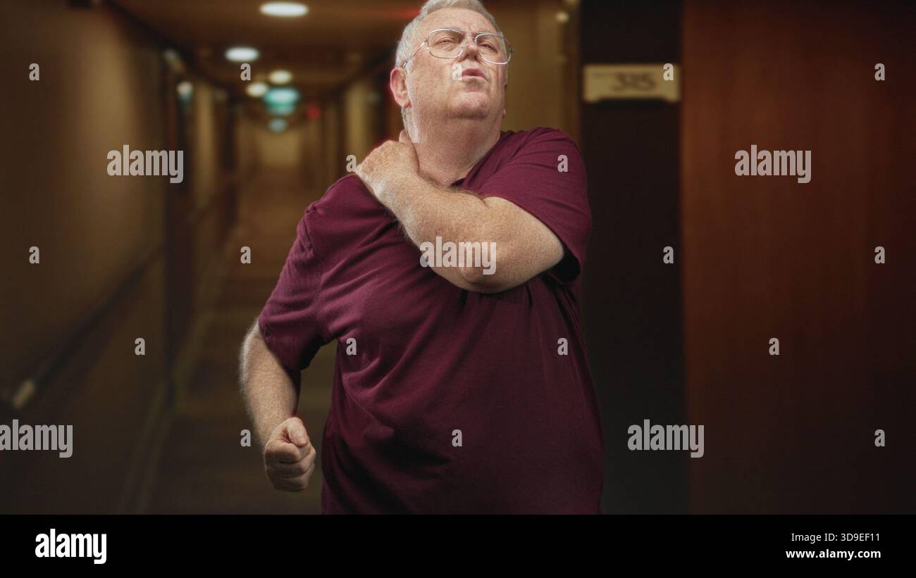 Man clutching shoulder rubbing hi-res stock photography and images - Alamy
