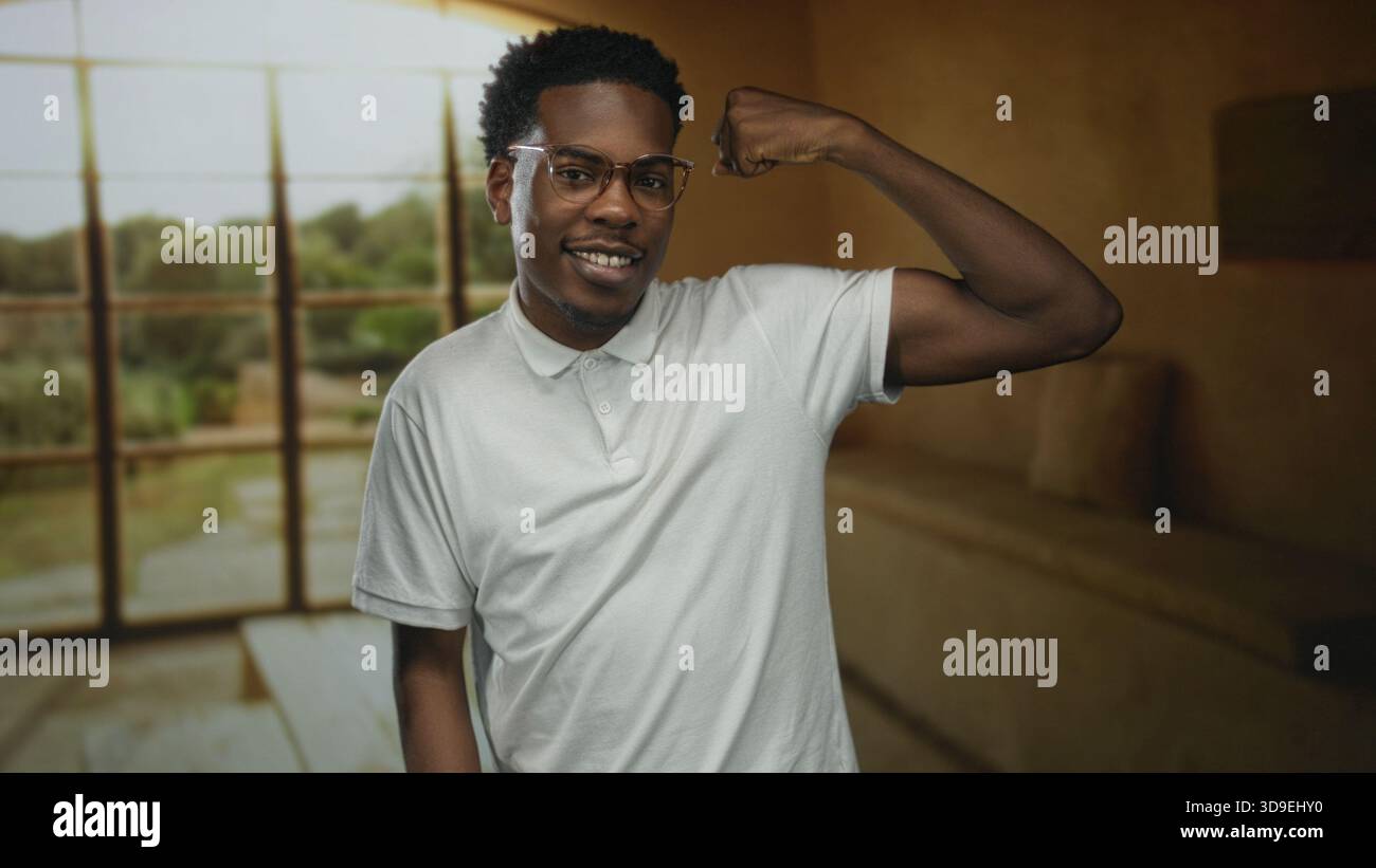 Man flexes bicep muscle inside hi-res stock photography and images - Alamy