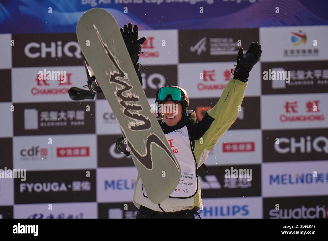 Lyon Farrell, of New Zealand throws his snowboard after competing in ...
