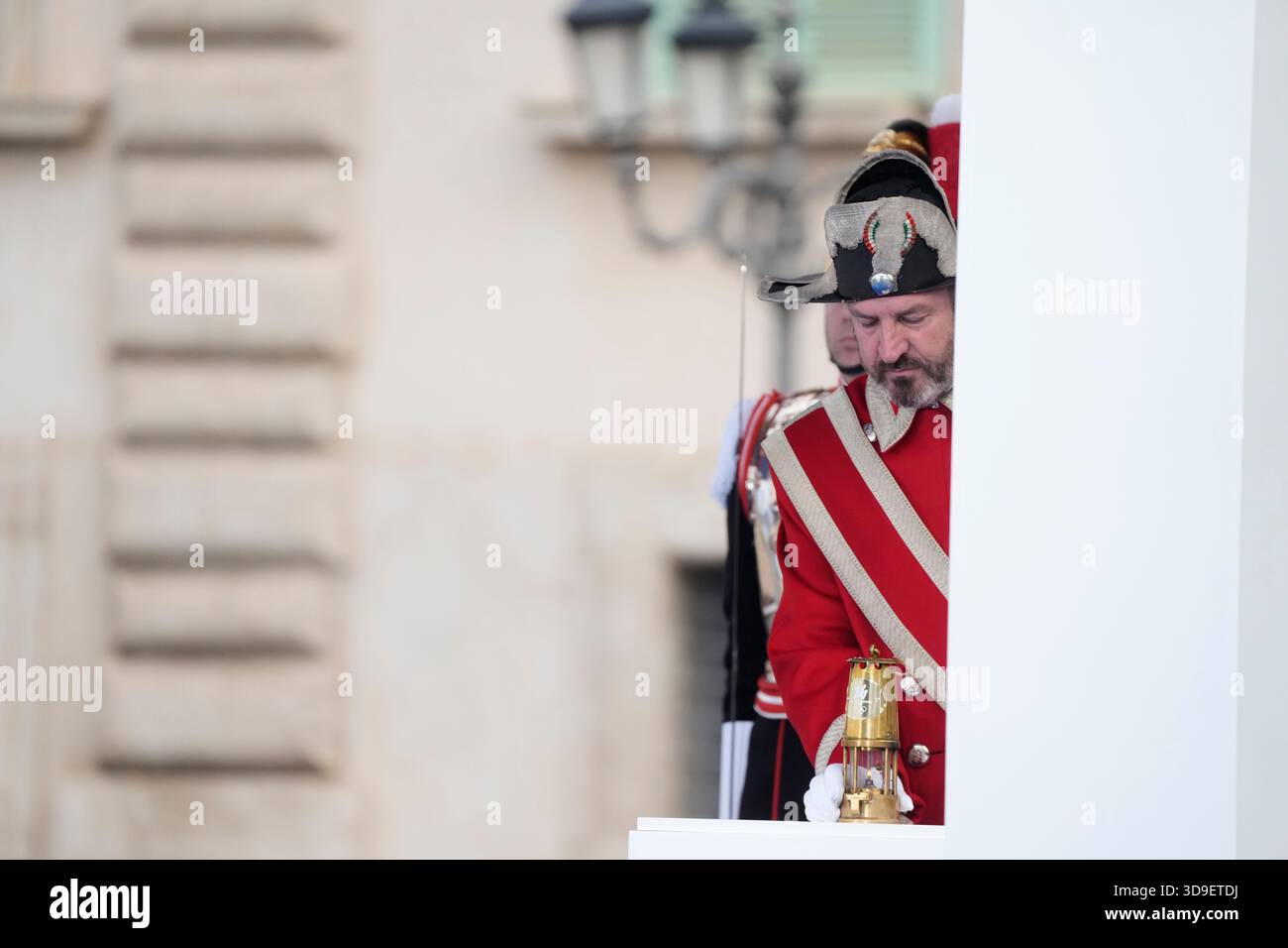 A cuirassier holds the torch lantern prior to the Milan Cortina 2026 ...