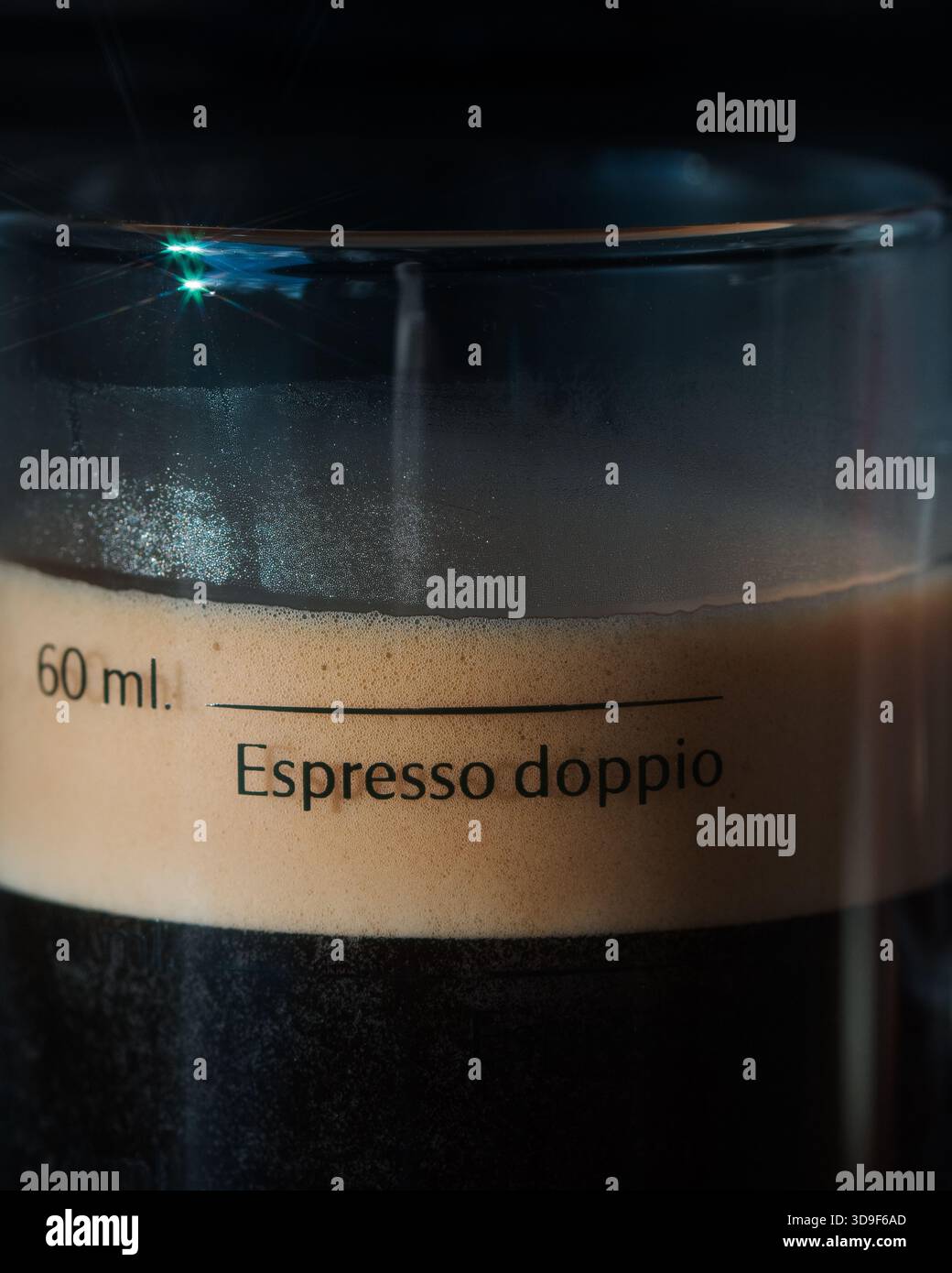 Espresso doppio glass filled with coffee Stock Photo - Alamy