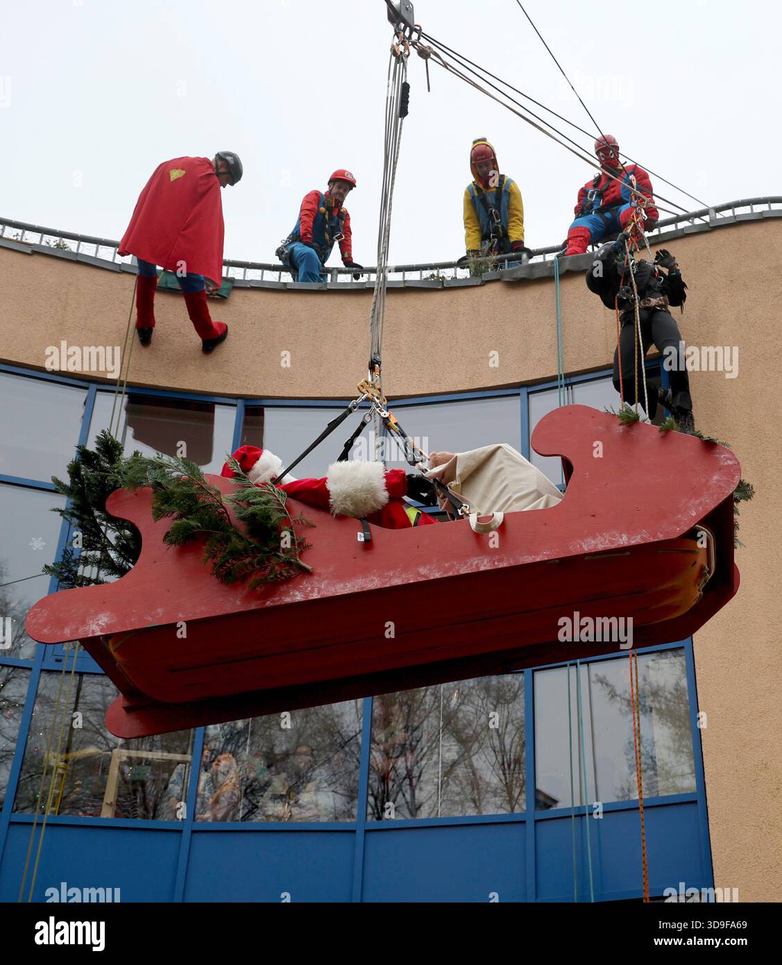 Rostock, Germany. 05th Dec, 2025. Santa Claus in a flying sleigh and ...