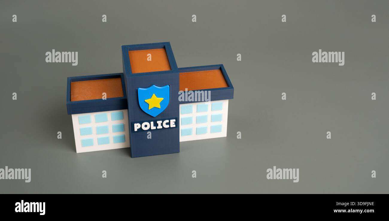 Miniature police station building representing law enforcement, public ...