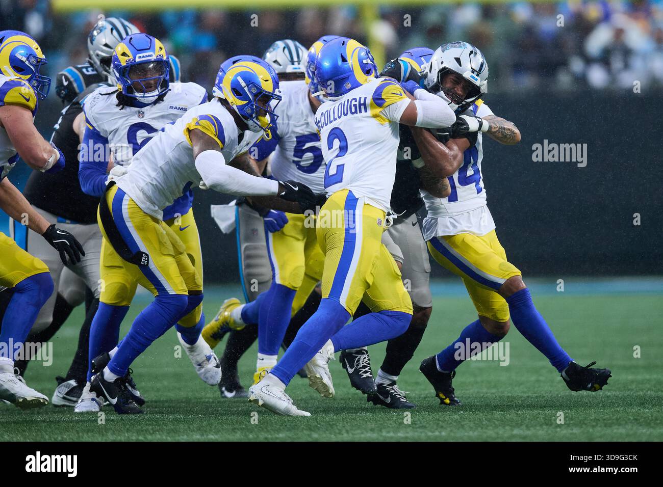 Carolina Panthers running back Chuba Hubbard (30) is wrapped up by Los ...