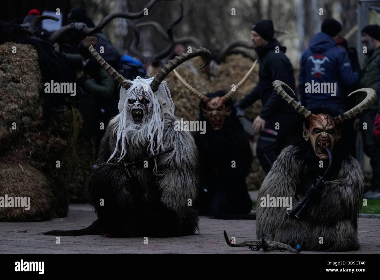 Participants wearing traditional Krampus and Perchten costumes perform ...