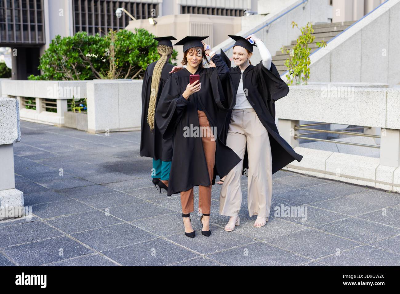 Diverse female graduates walking hi-res stock photography and images ...