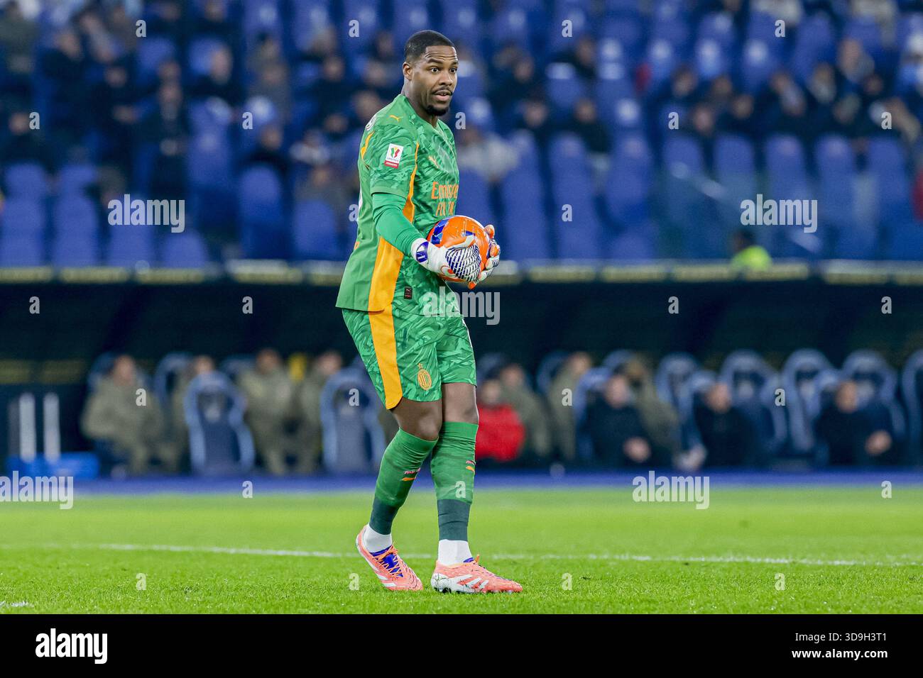 Milan's French goalkeeper Mike Maignan controls the ball during Coppa ...