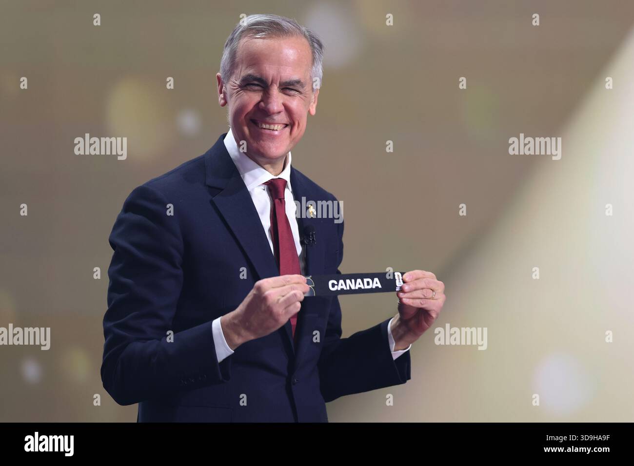 Canadian Prime Minister Mark Carney smiles during the draw for the 2026 ...