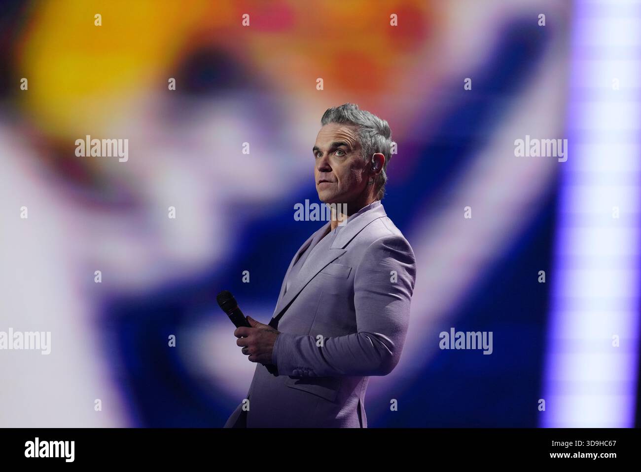 Singer Robbie Williams performs during the draw for the 2026 soccer ...