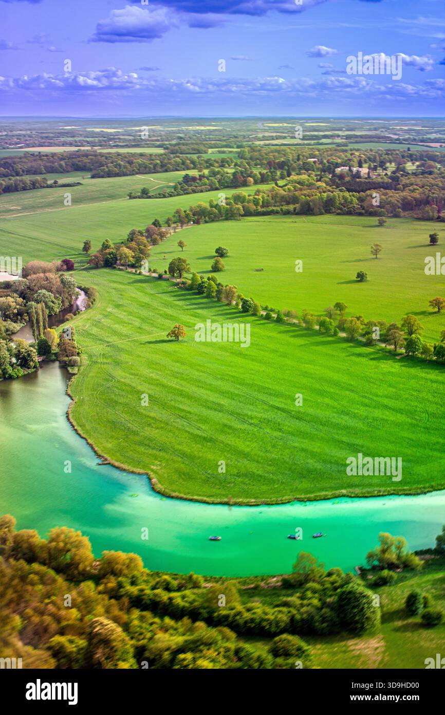 Landscape around Luton in the UK shows green fields and a river. This ...