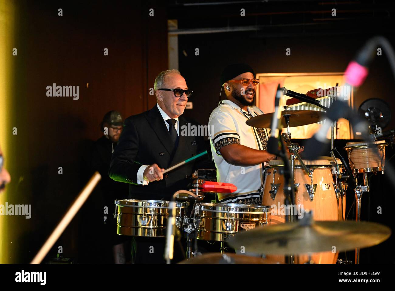 Emilio Estefan plays the drums during Gary Nader Art Centrer kick off ...
