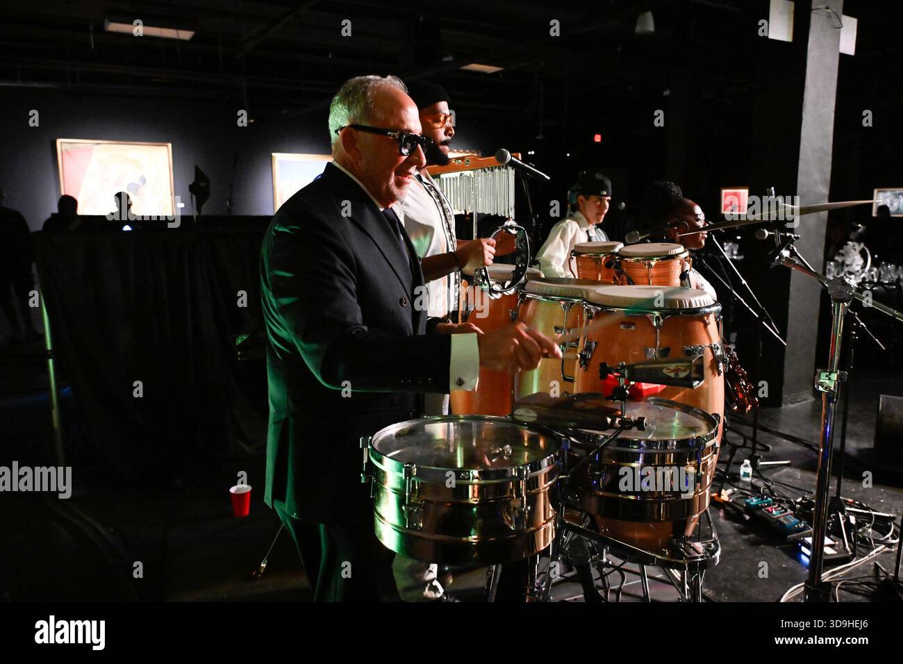 Emilio Estefan plays the drums during Gary Nader Art Centre kick off ...